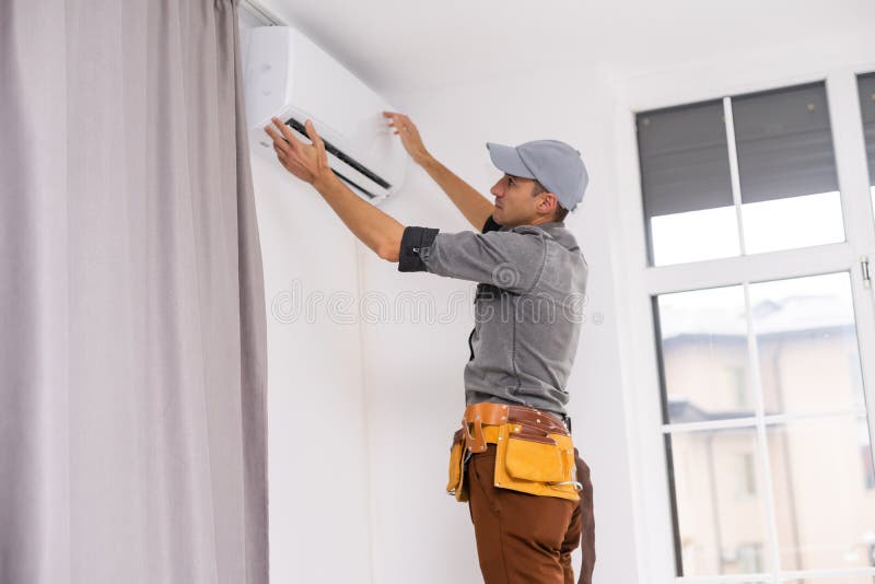 Service Personnel are Working in a Room of the House Stock Photo ...