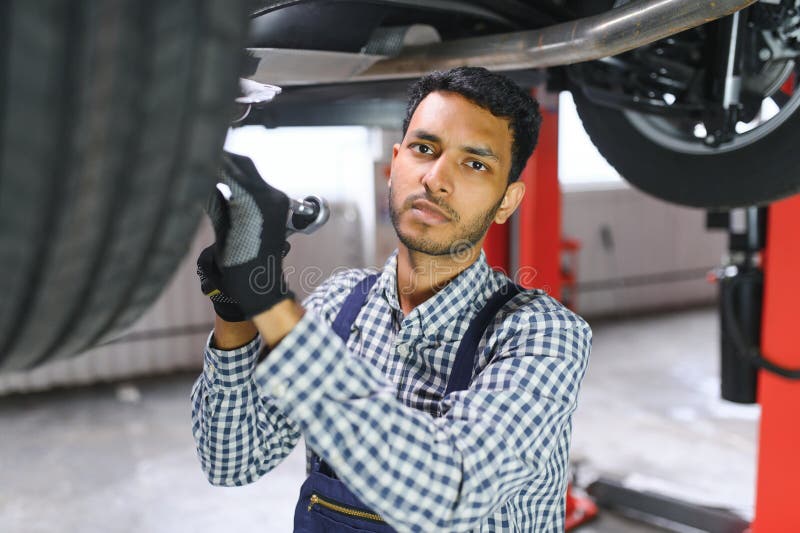 Indian Car Mechanic Standing and Working in Service Station. Car ...