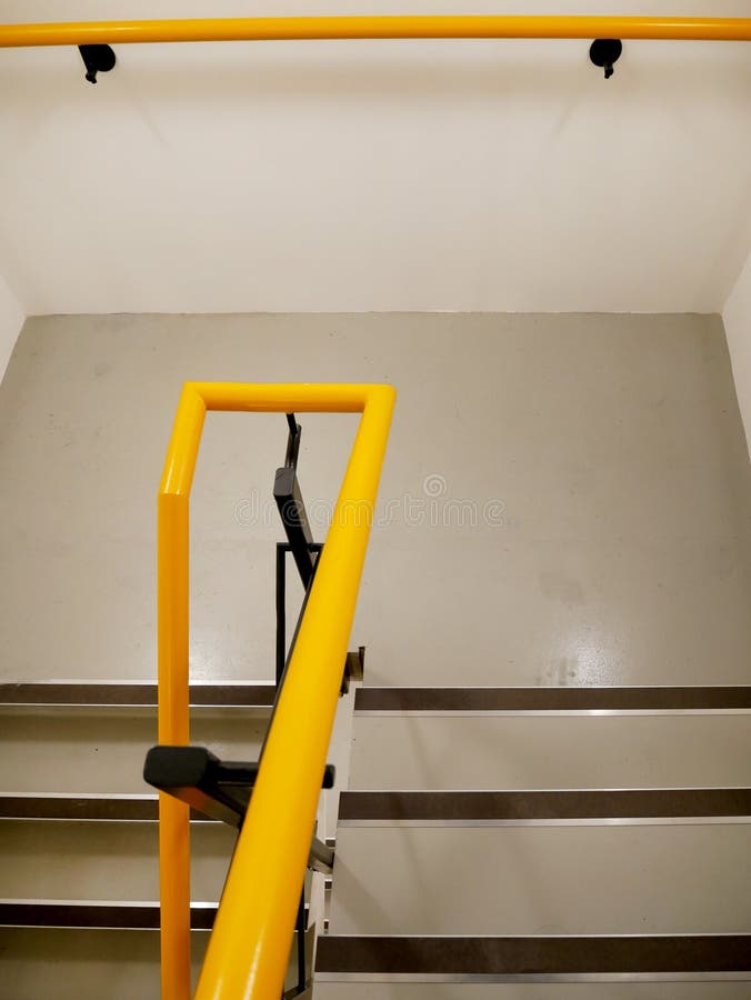 Service Staircase with Marked Steps and Yellow and Black Handrail Stock ...