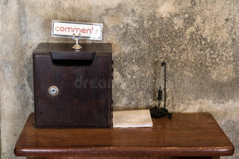 A Service Table with Box and Form for Comments Stock Image - Image of ...