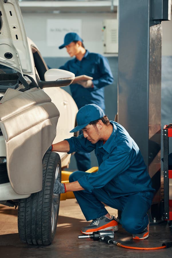 Working in garage stock image. Image of people, auto - 74528969