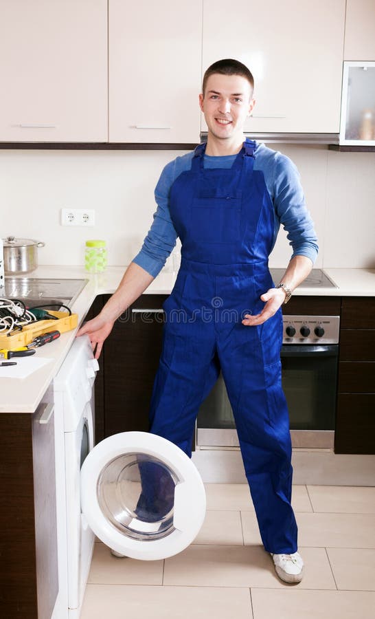 Service Worker Repairing Washing Machine Stock Image - Image of ...