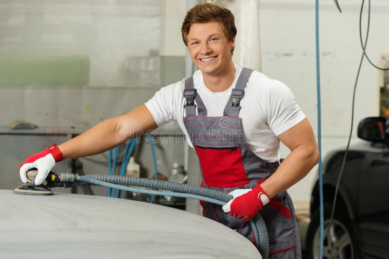 Serviceman in a Car Workshop Stock Image - Image of professional ...