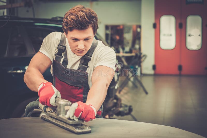 Serviceman In A Car Workshop Stock Photo - Image of people, machine ...