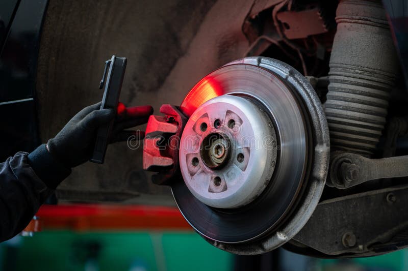 Serviceman Checks the Brake Discs of a Car Stock Image - Image of ...