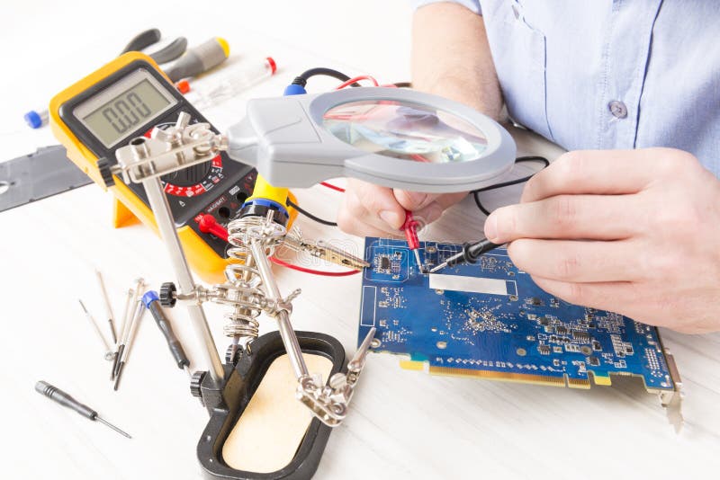 Serviceman Checks PCB with a Digital Multimeter Stock Image - Image of ...