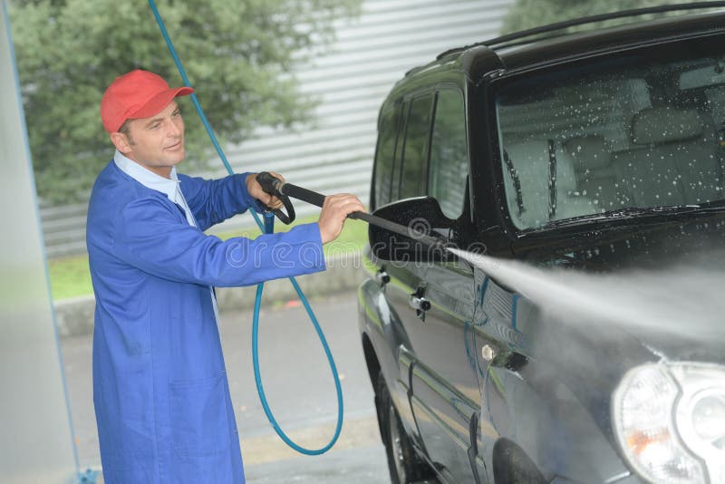 Serviceman with High Pressure Water Jet Washing Car Stock Photo - Image ...