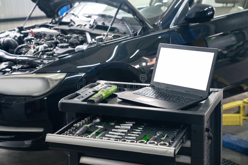 Serviceman with Laptop Checks Car Software in Car Service Stock Image ...