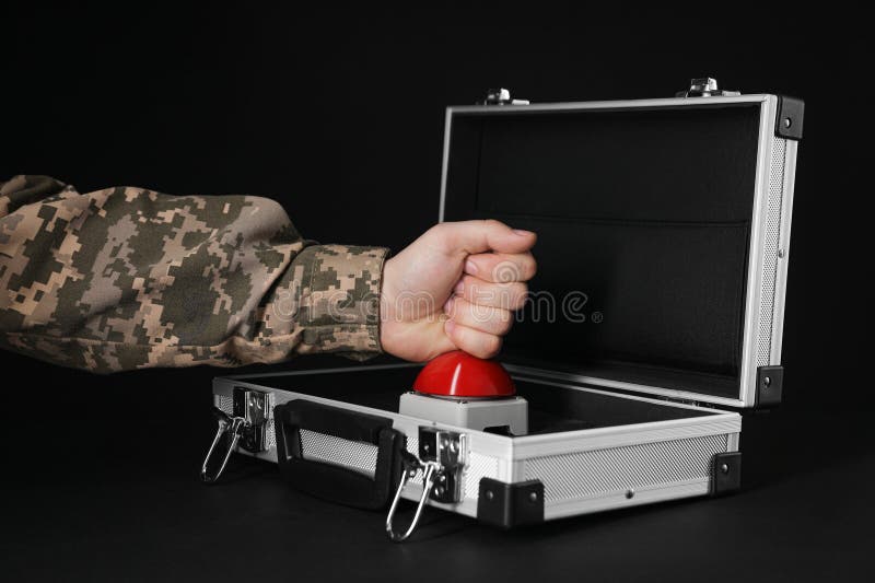 Serviceman Pressing Red Button of Nuclear Weapon at Black Table ...
