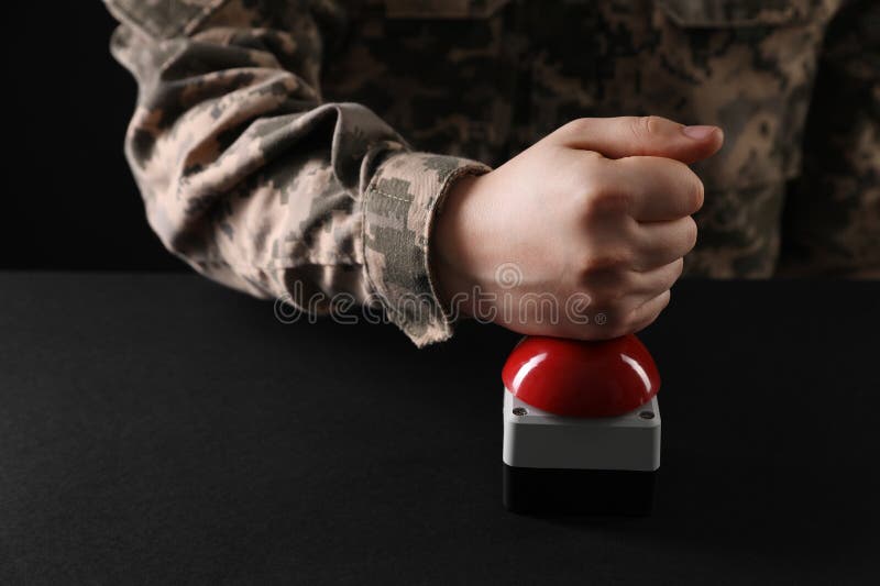 Serviceman Pressing Red Button of Nuclear Weapon at Black Table ...