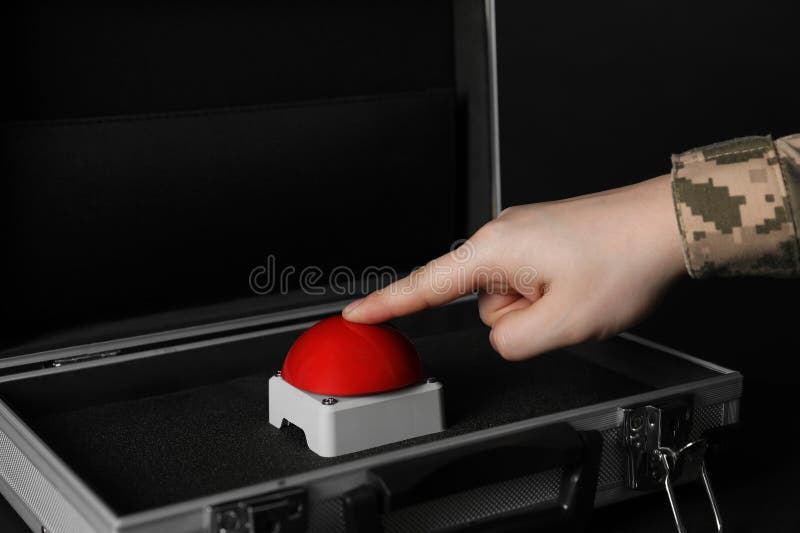 Serviceman Pressing Red Button of Nuclear Weapon at Black Table ...