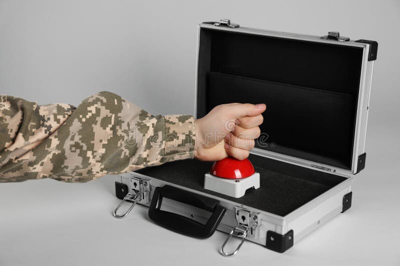 Serviceman Pressing Red Button of Nuclear Weapon at Black Table ...