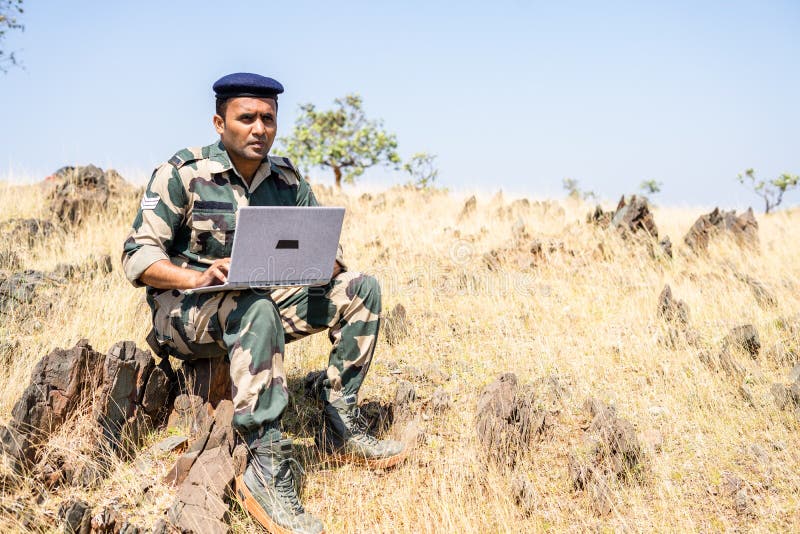 Serviceman Using Laptop on Top of Mountain for Gathering Data - Concept ...