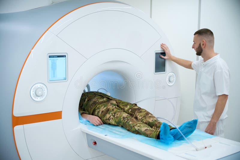 MR Technologist Preparing Military Man for Magnetic Resonance Imaging ...