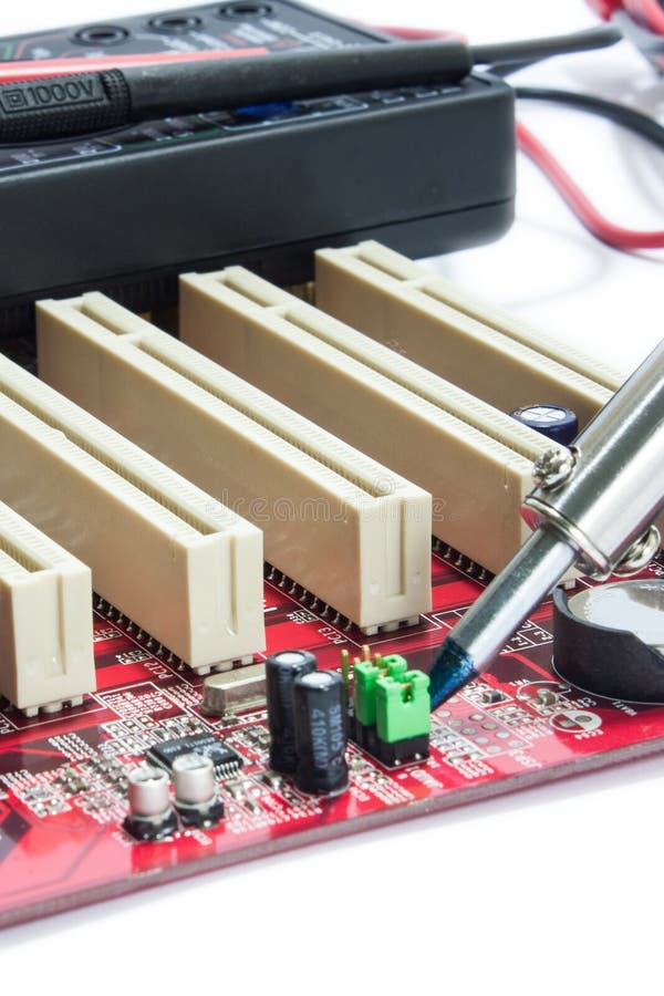 Servicer Soldered Circuit Board with a Soldering Iron Stock Image ...