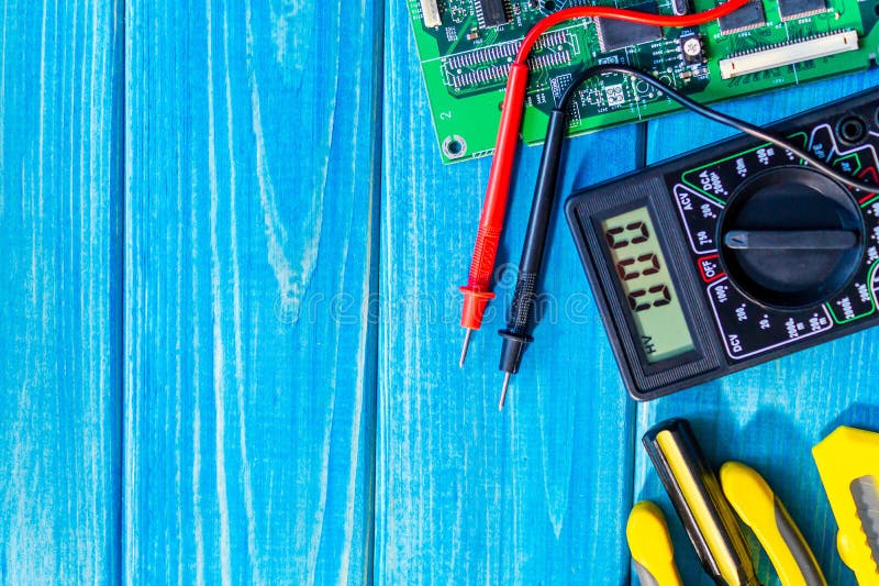 Services for the Production of Electronics and Repair on a Wooden Blue ...