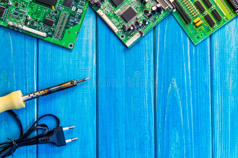 Services for the Production of Electronics and Repair on a Wooden Blue ...