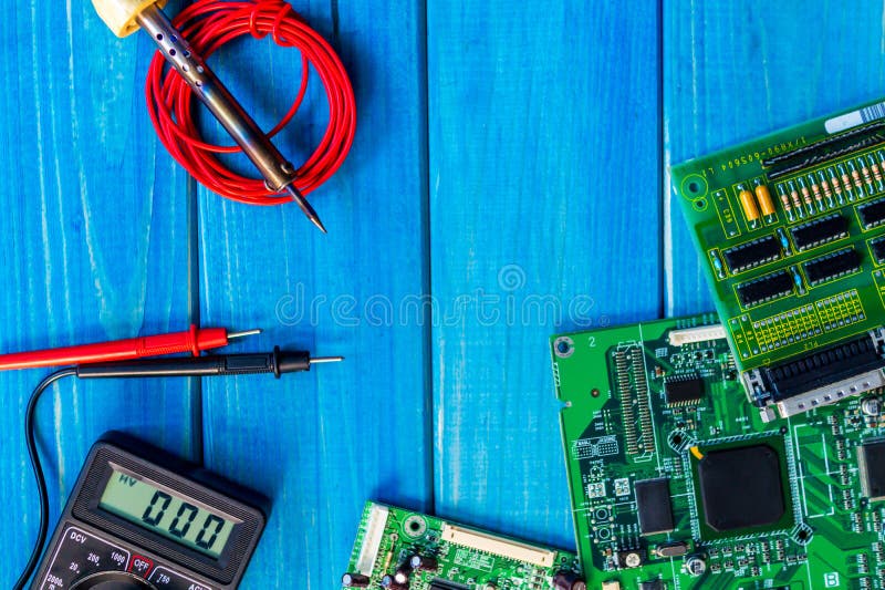 Services for the Production of Electronics and Repair on a Wooden Blue ...