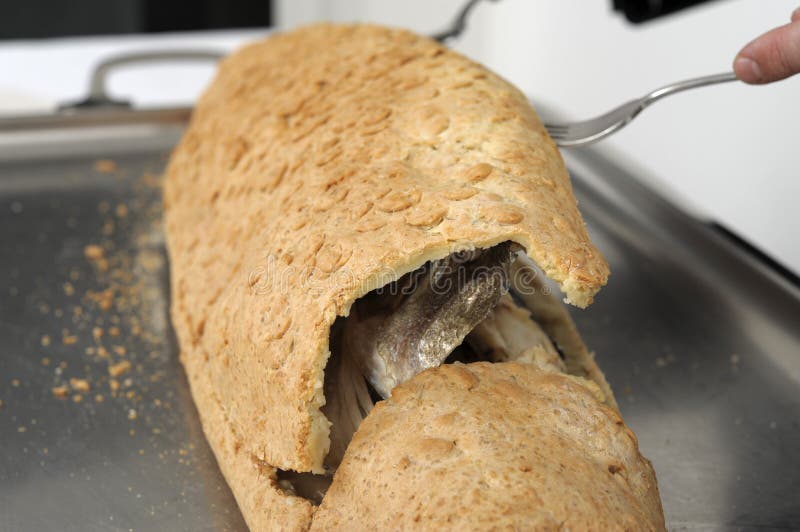Serving a Bass Baked in Salt Crust Stock Image - Image of restaurant ...