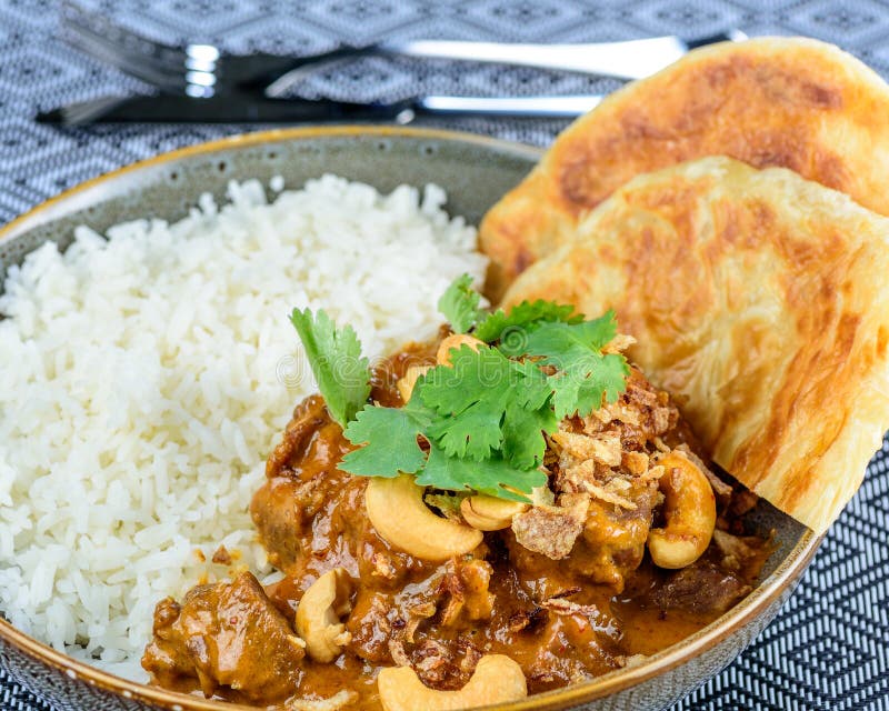 A Serving Of Beef Curry, With White Rice And Roti Bread Stock Image ...