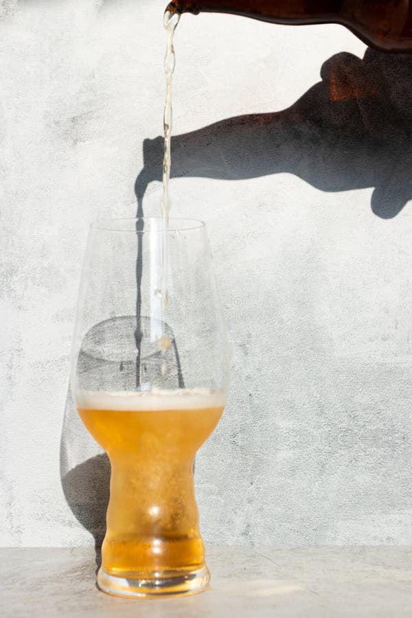 Serving Beer in a Crystal Glass for IPA Stock Image - Image of bubble ...