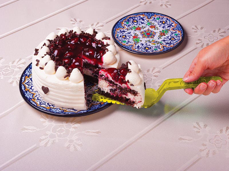 Man Serving Birthday Cake To Friends at Dining Table Stock Photo ...