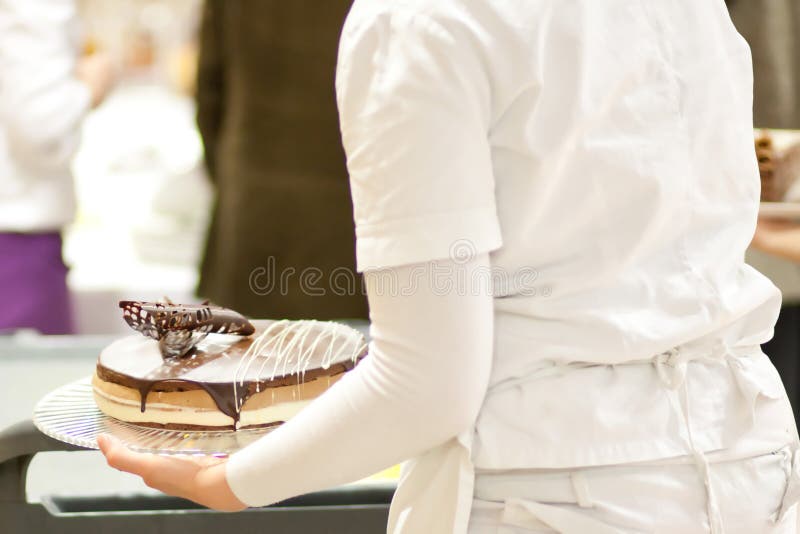 Serving a cake stock photo. Image of dining, cater, hand - 27430700