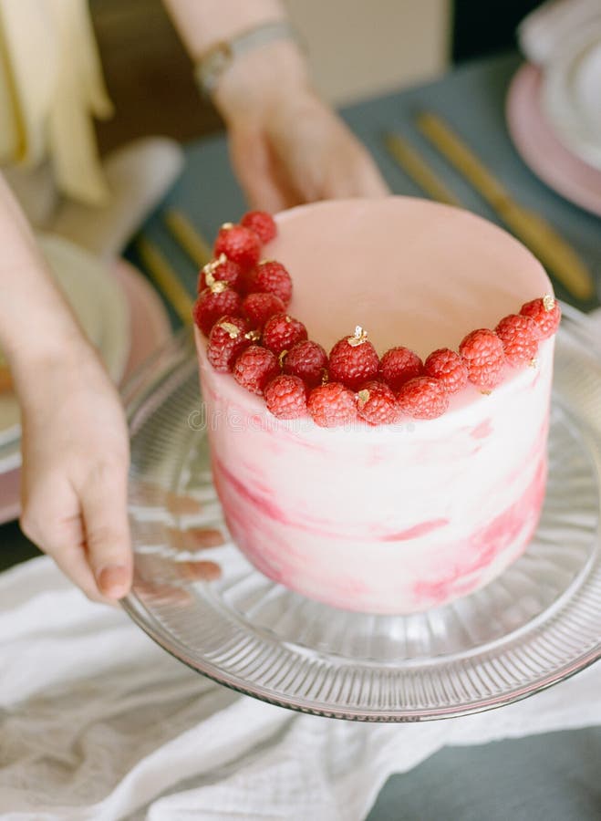 Serving a Cake Decorated with Raspberries To the Table Stock Photo ...