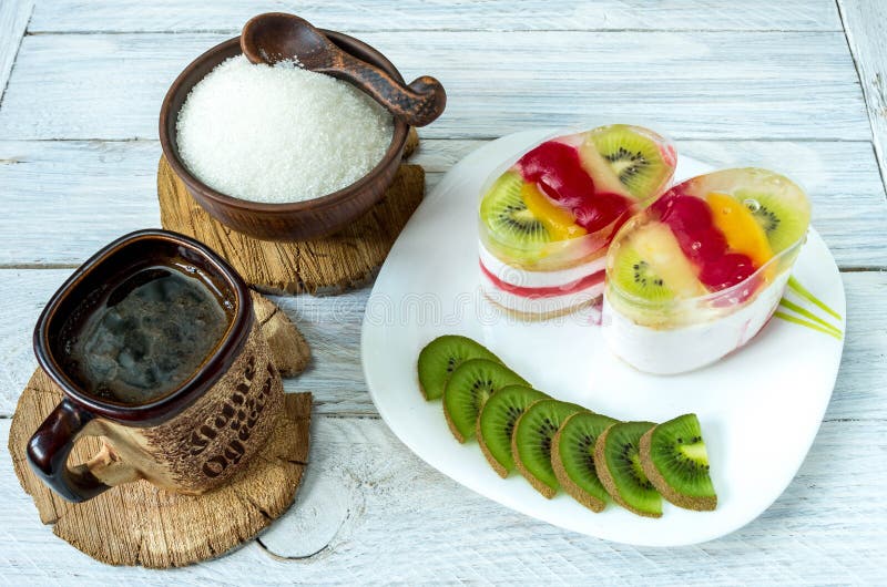 Serving Coffee Break. Cheesecake with Fruit Slices and Sliced Kiwi ...