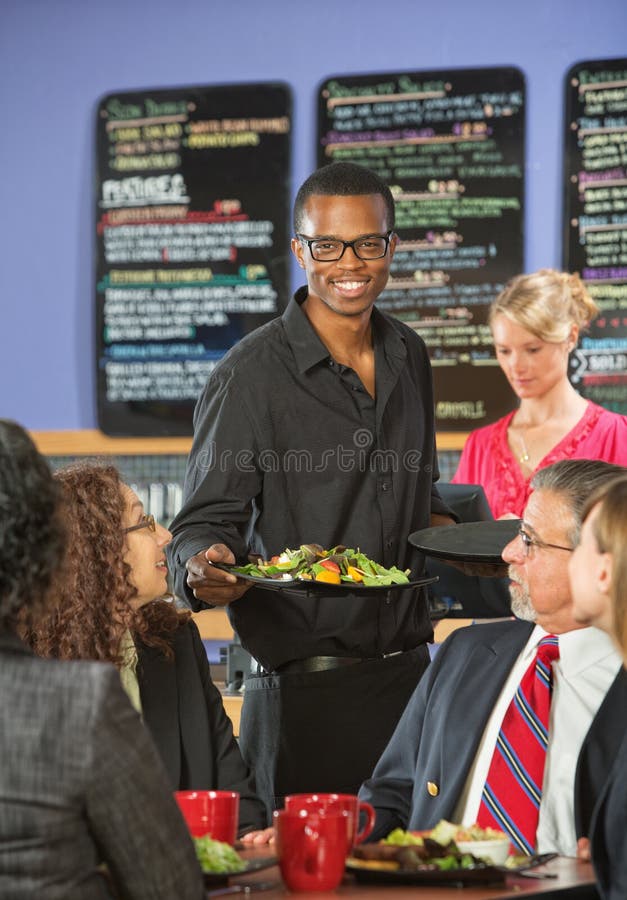 Waiter Bringing Food To Customers Stock Image - Image of adult, diverse ...