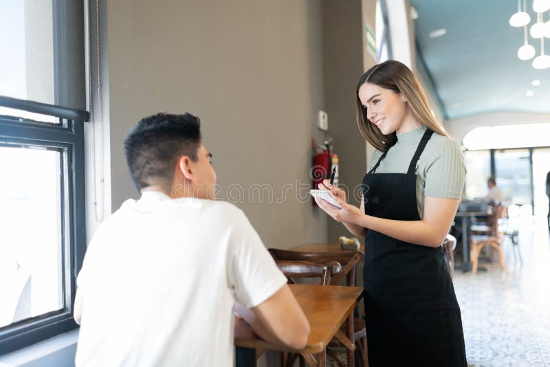 Serving Customers with a Smile Stock Photo - Image of caucasian ...