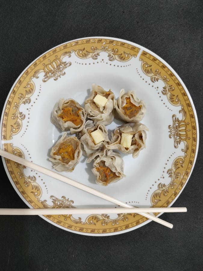A Serving of Dim Sum Placed on a Patterned Glass Plate Stock Image ...