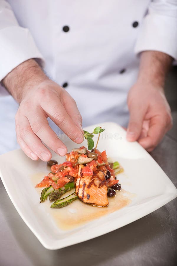 Serving the dish stock photo. Image of chef, unrecognizable - 34055886