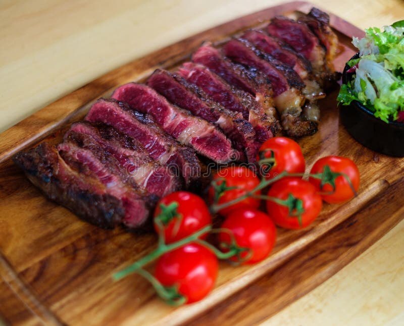 Serving Freshly Cooked Beef Steak on a Wooden Board Stock Image - Image ...