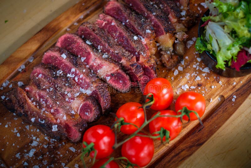 Serving Freshly Cooked Beef Steak on a Wooden Board Stock Image - Image ...
