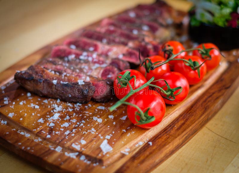 Serving Freshly Cooked Beef Steak on a Wooden Board Stock Image - Image ...