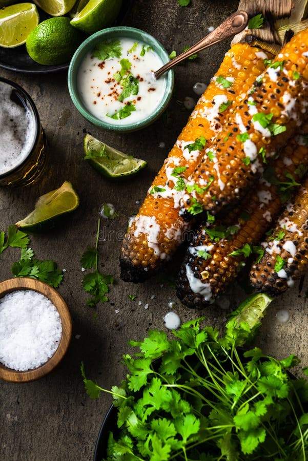 Serving Grilled Corn Cob with Fresh Herbs,lime,beer at Picnic, Top Down ...