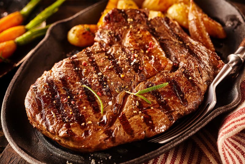 Serving of Marinated Rib Eye Steak with Potatoes Stock Photo - Image of ...