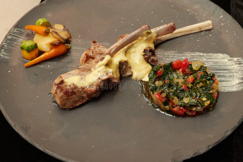 Serving Rack of Lamb on a Plate. Vegetable Stew. Sauce Stock Photo ...