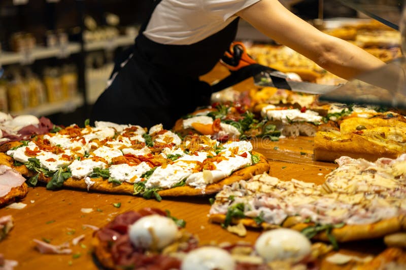 Serving a Slice Cut from a Sicilian Style Rectangular Cheese and Tomato ...
