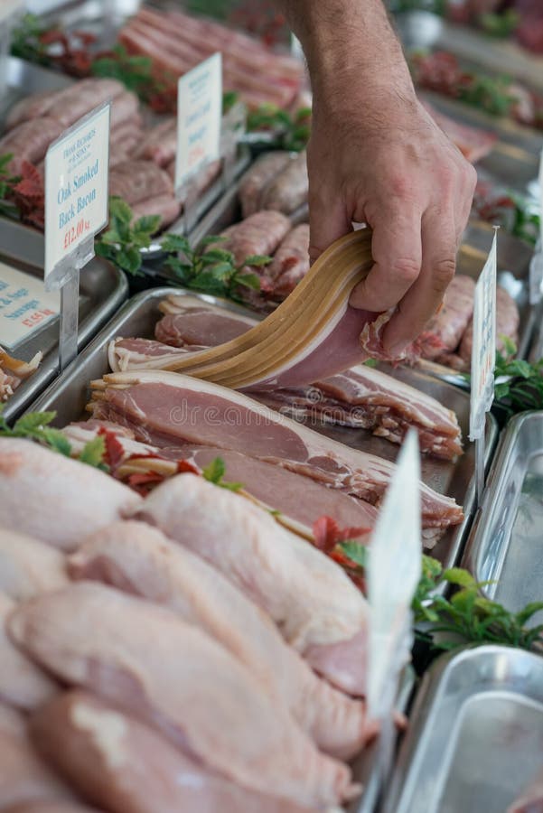 Serving Slices of Raw Bacon from a Display Stock Photo - Image of meat ...