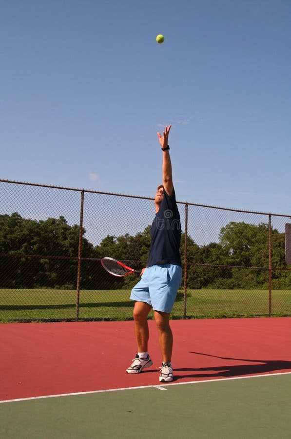Serving a tennis ball stock image. Image of open, people - 23361655