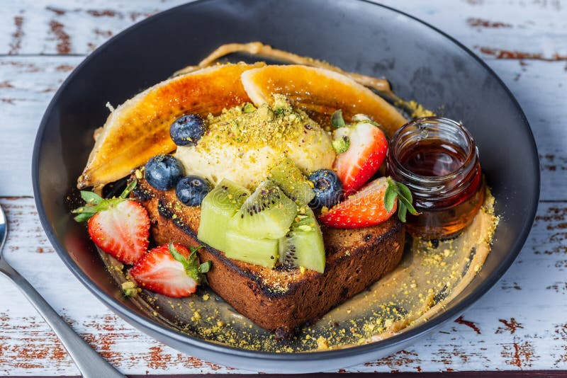 A Serving of Toasted Banana Bread with Pieces of Fruit Stock Photo ...