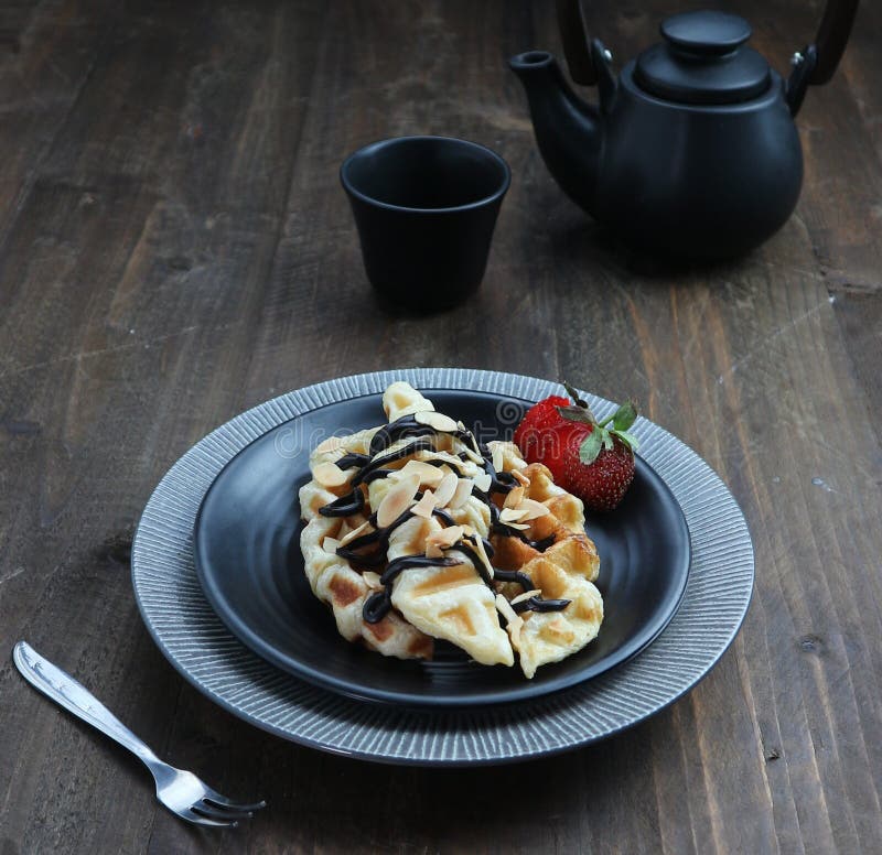 Serving of Waffles on a Plate with a Cup of Tea Stock Image - Image of ...