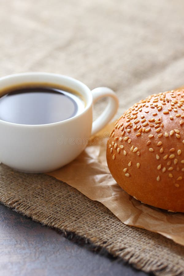 Sesame Bun and Coffee Mug on Paper Wrapping Kraft and on Burlap ...