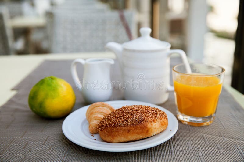 Sesame Bun, Tangerine and Tea for Breakfast Stock Image - Image of ...