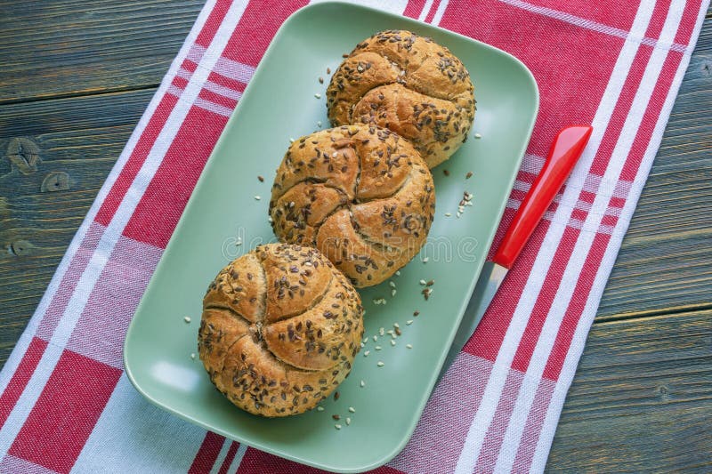 Sesame Kaiser Rolls, Round Bread Rolls on Plate Stock Photo - Image of ...