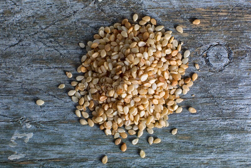 Sesame Seeds on Rustic Wood Surface Stock Image - Image of wood ...