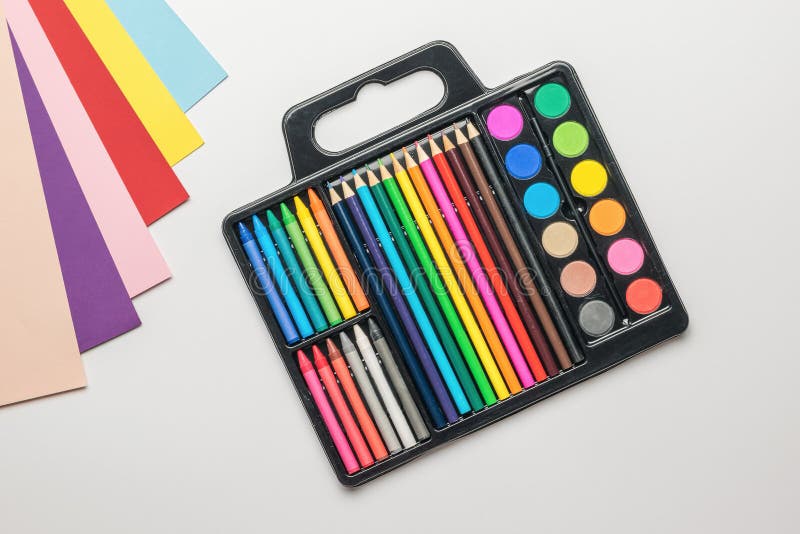 A Set for the Artist and Samples of Colored Paper on a White Background ...