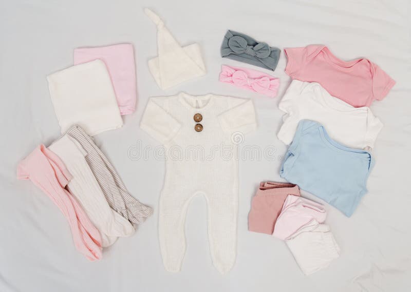 Set of Baby Clothes and Accessories on White Bed Stock Image - Image of ...